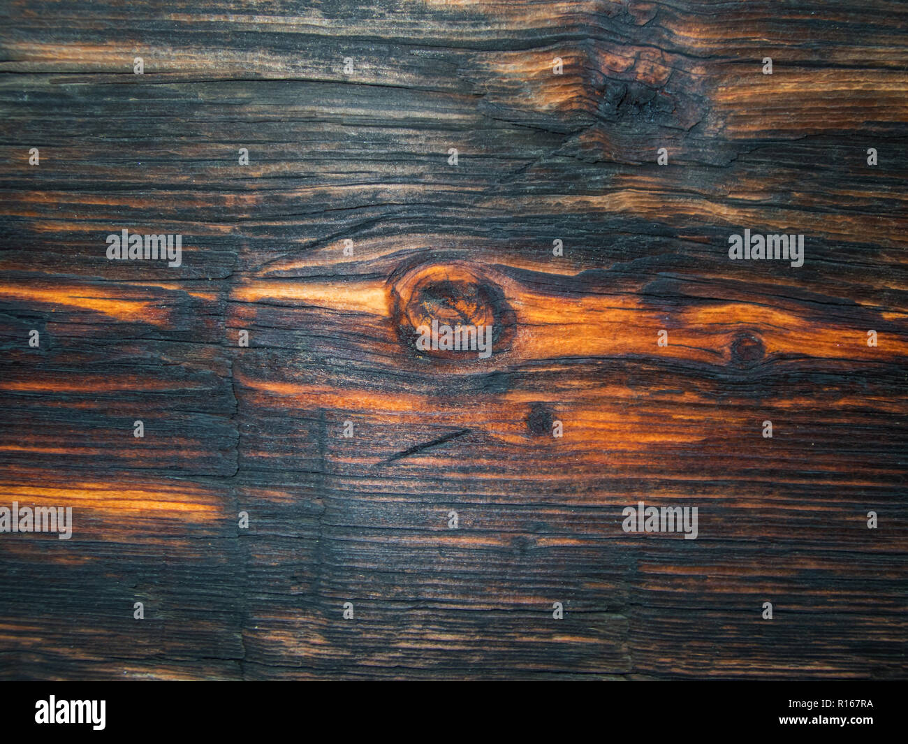 Knot hole on a a beautiful wood plank makes a pretty background and ...