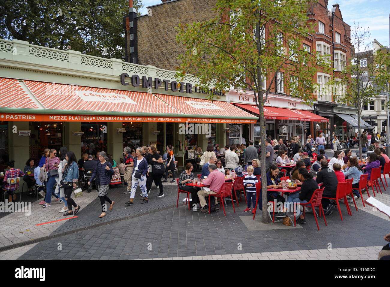 Diners outside Comptoir Libanais Lebanese counter style restaurant on ...