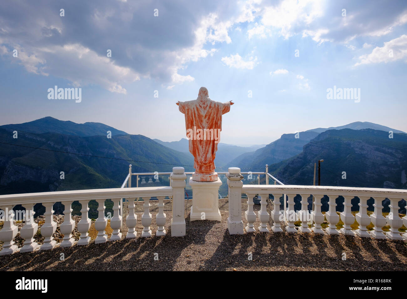 Statue of Christ in Delaj, view into the Cijevna gorge, near Podgorica ...