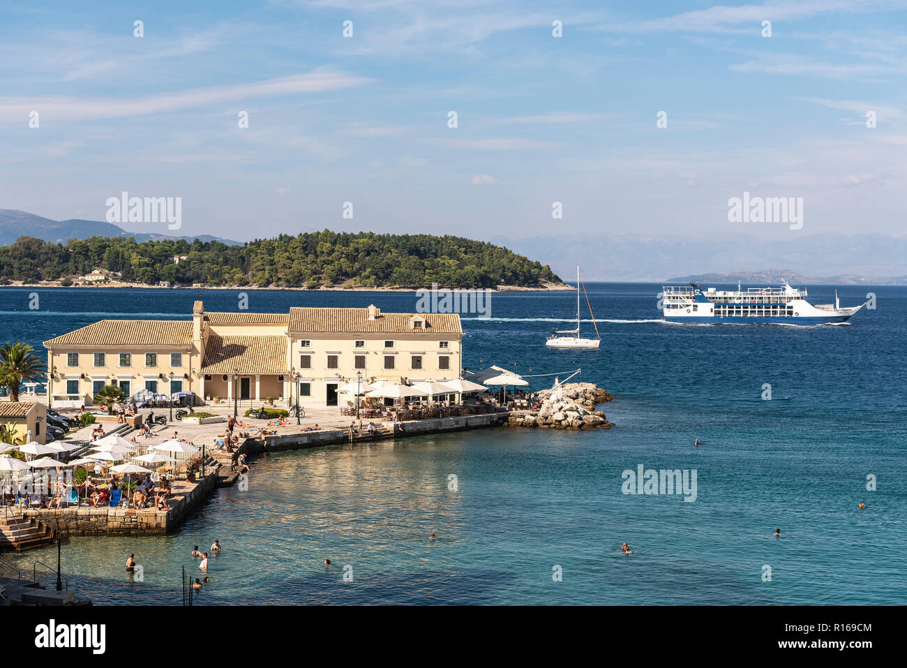 Faliraki bath, bay, restaurant, behind the island Vido, Kerkyra, island ...