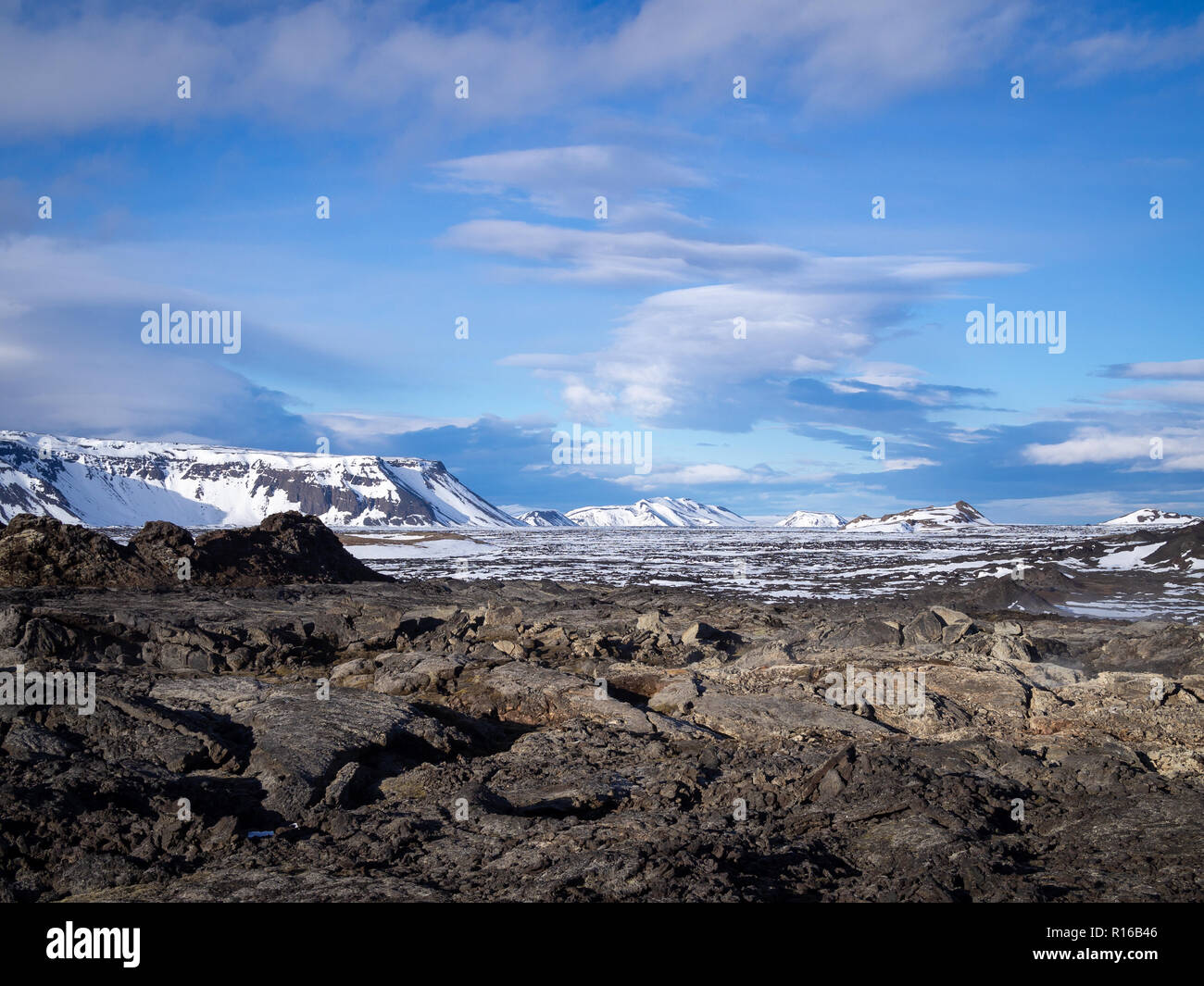 Icelandic vulcano landscape with a snowy mountains top on horizonin in ...