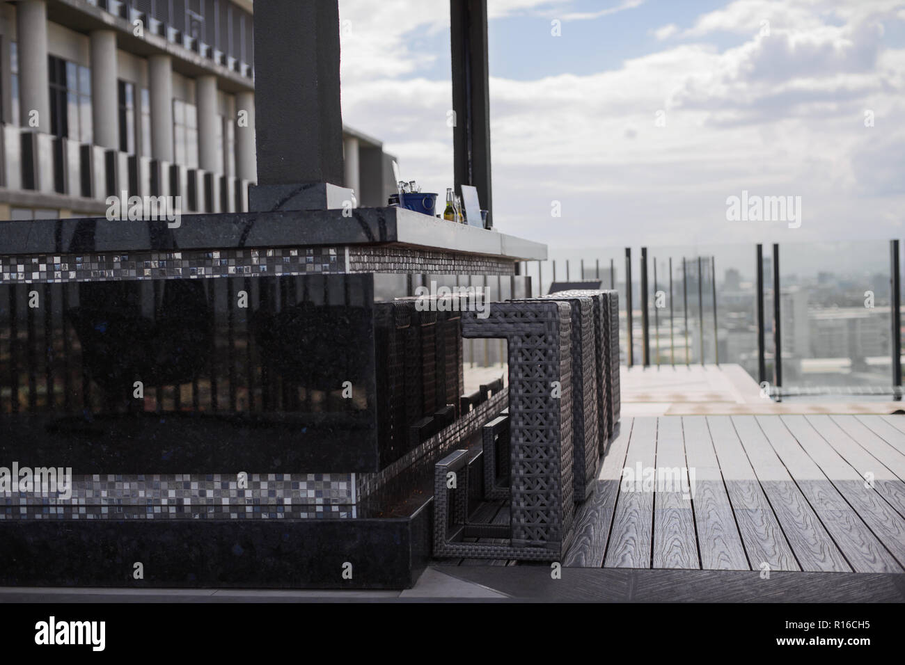 Roof top hotel pool with spa section and a nice view in a relax scenery ...