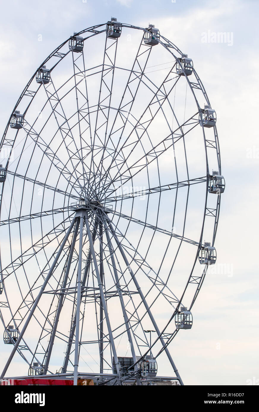 Carnival ride showing a spinning ferris wheel in action- long exposure ...