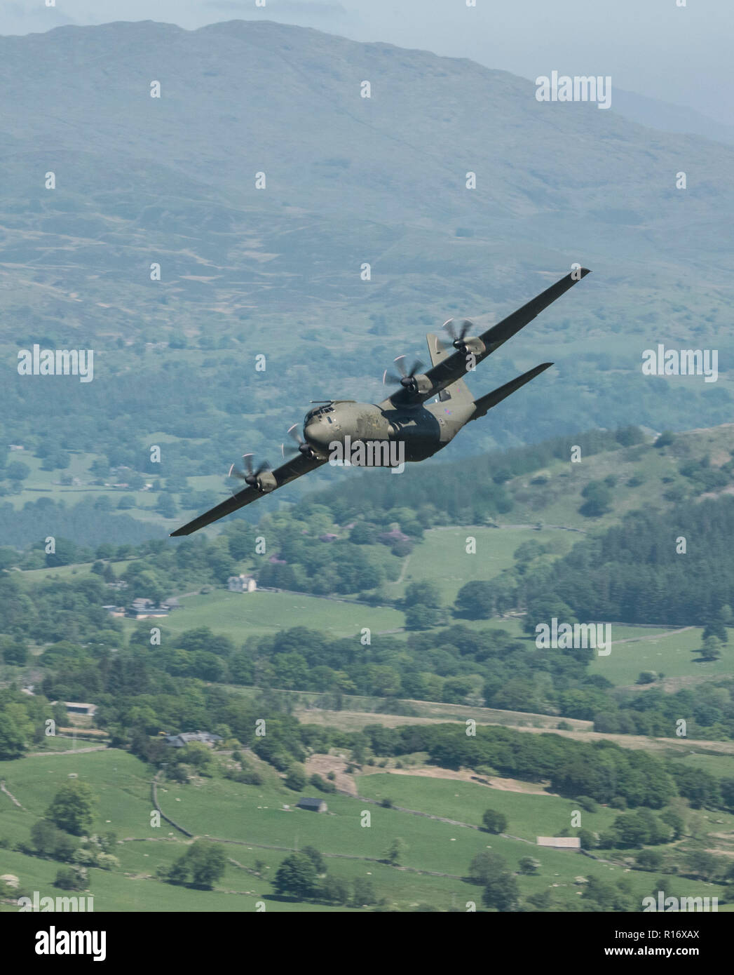 Raf military aircraft Hercules C-130 transport plane low flying in the ...