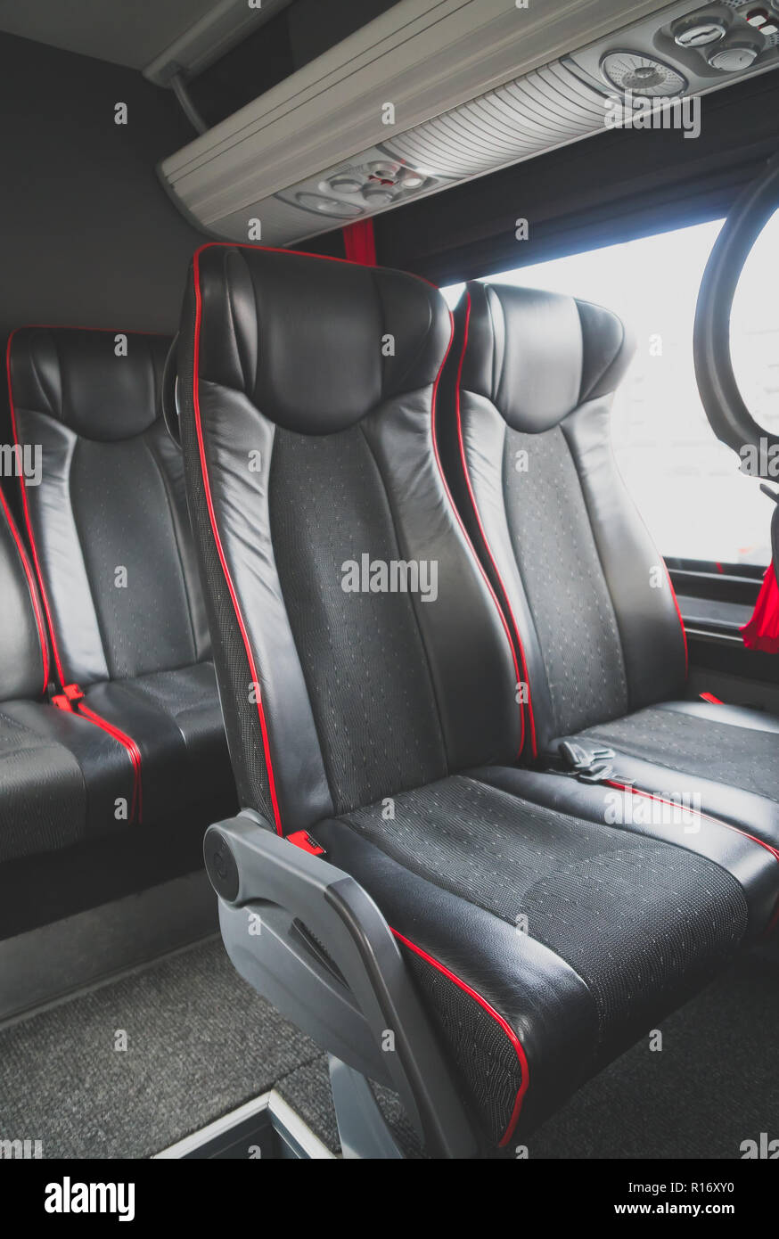 Seats in the cabin of a modern minibus Stock Photo - Alamy