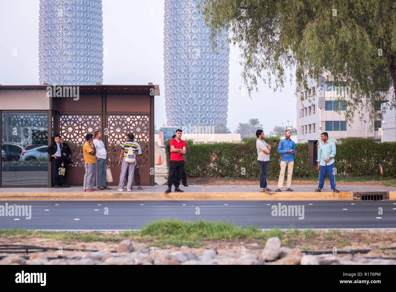 Passengers waiting for public transport at Bus Stop, Abu Dhabi, UAE ...