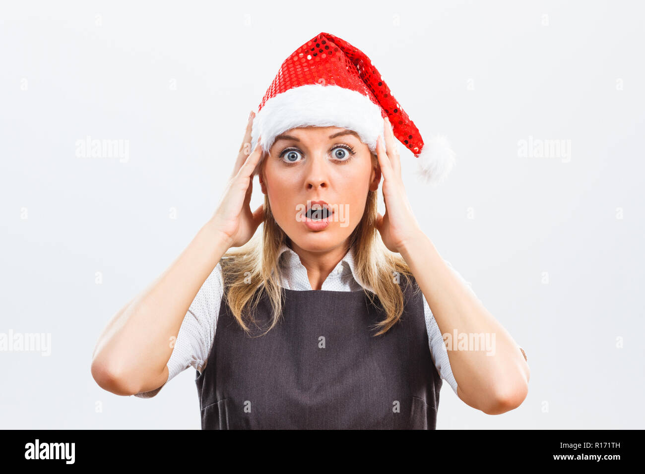 Shocked business woman with Santa Hat in panic Stock Photo - Alamy