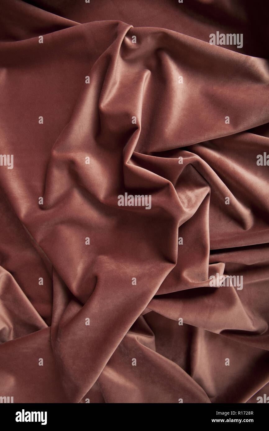 close-up view of an old pink velvet curtain. Minimal color still life ...
