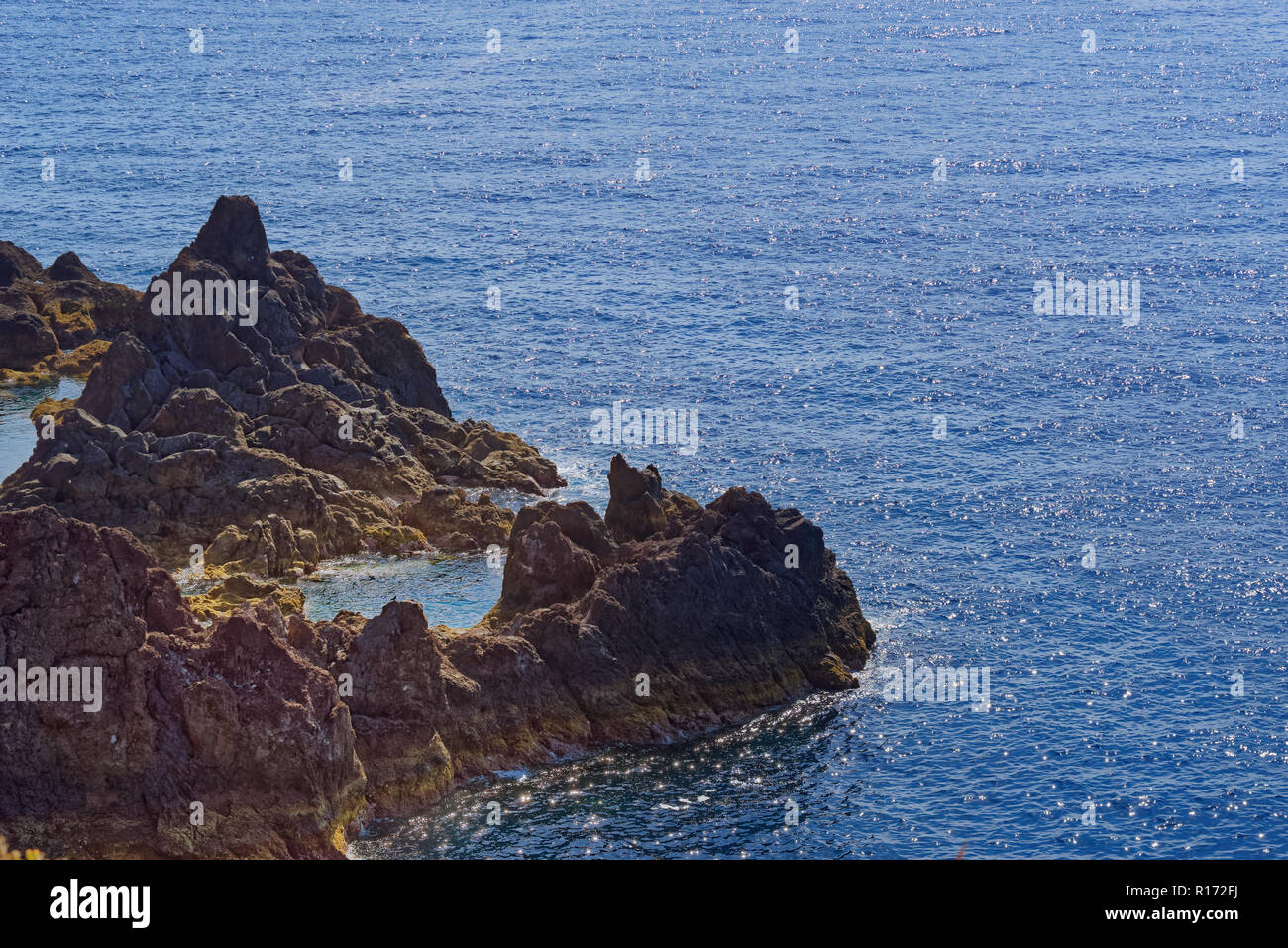 Rock formation in the blue water of Atlantic ocean. Madeira island ...