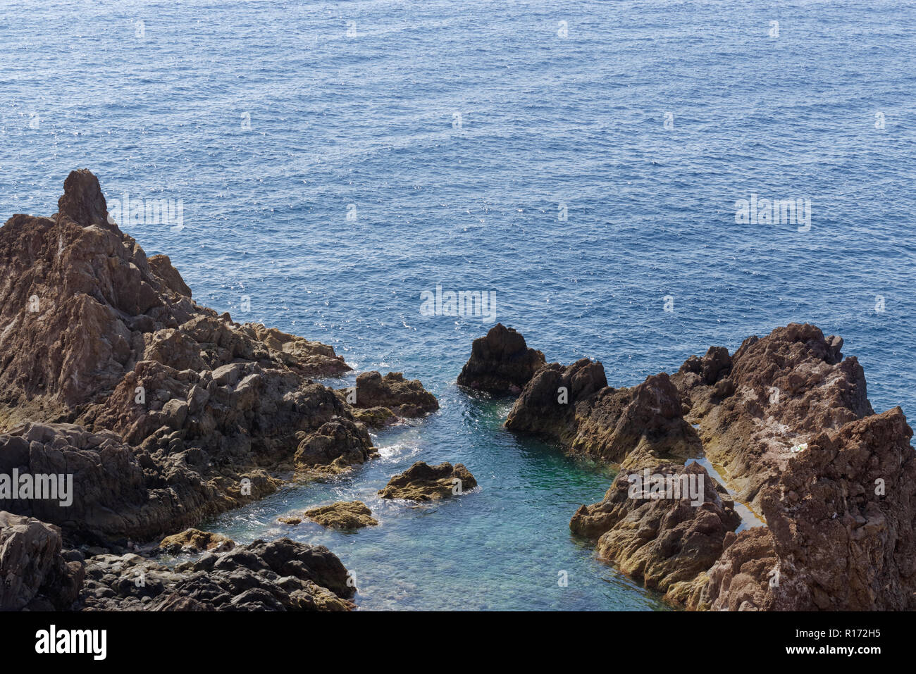 Rock formation in the blue water of Atlantic ocean. Madeira island ...