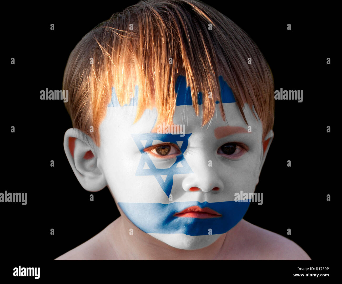 Little boy with painted Flag of Israel isolated on black background ...
