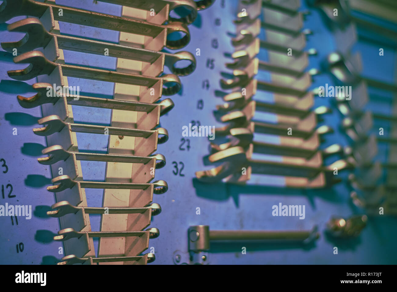 Blue board in ship's engine workshop with plent different types of ...