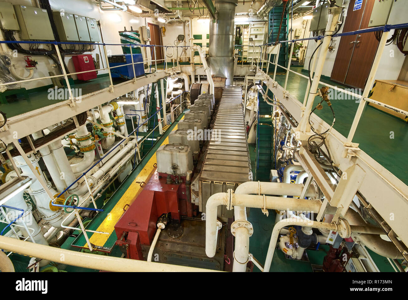 Panoramic view of main engine on a merchant ship in the engine room ...