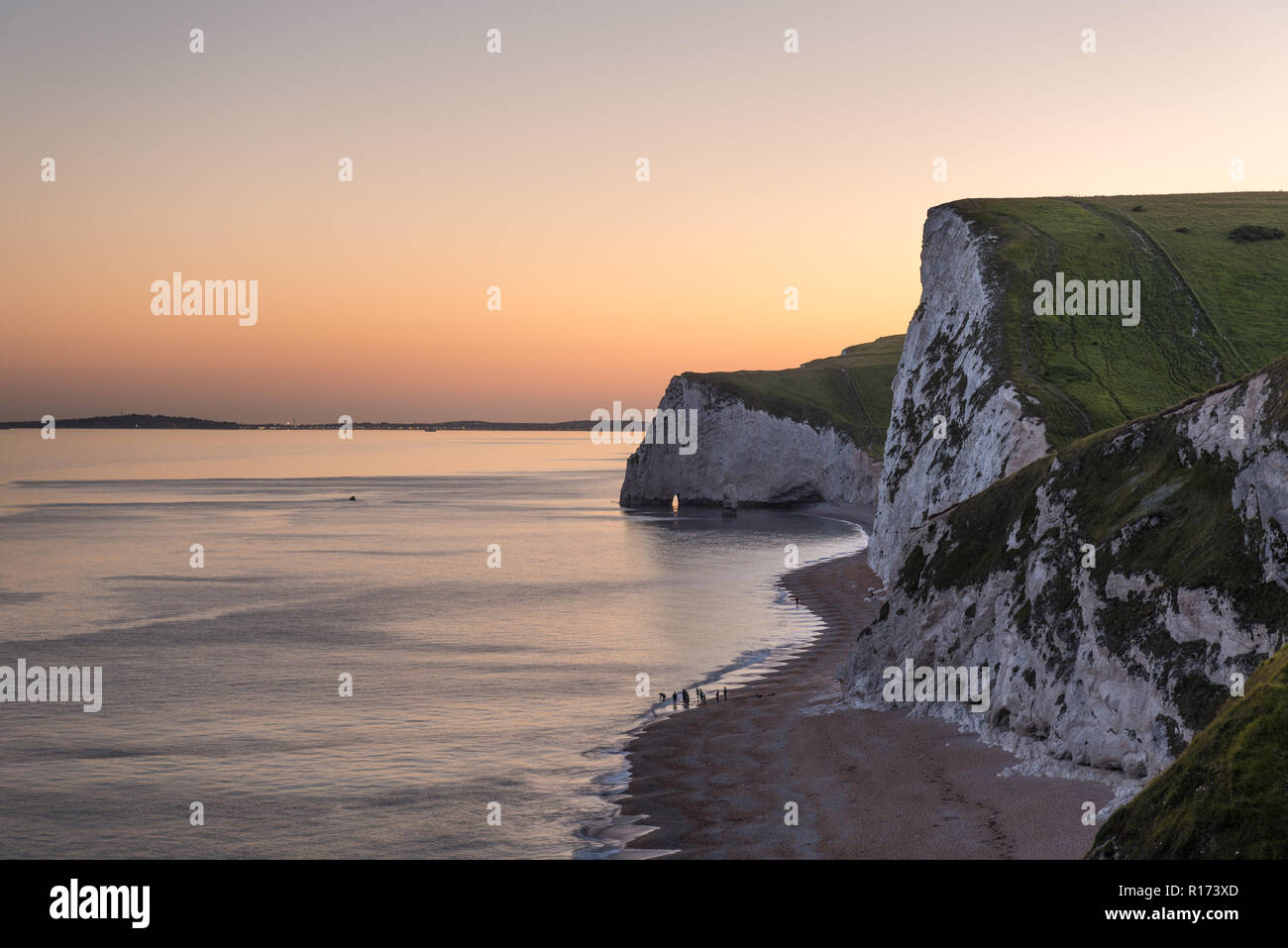 Chalk cliffs tower over the Jurassic Coast at Dorset UK Stock Photo - Alamy