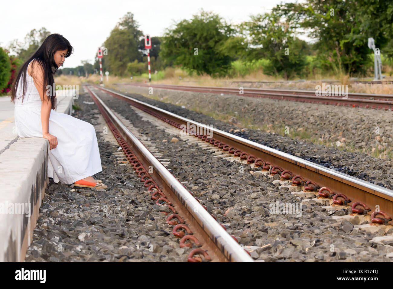 Girl sitting alone in train hi-res stock photography and images - Alamy