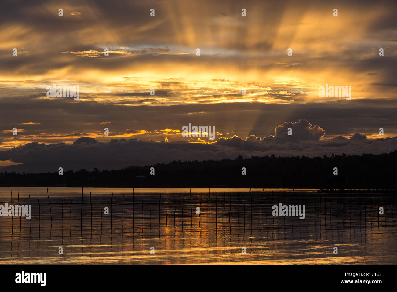 Dramatic tropical sunset in the Samal island, Philippines Stock Photo ...