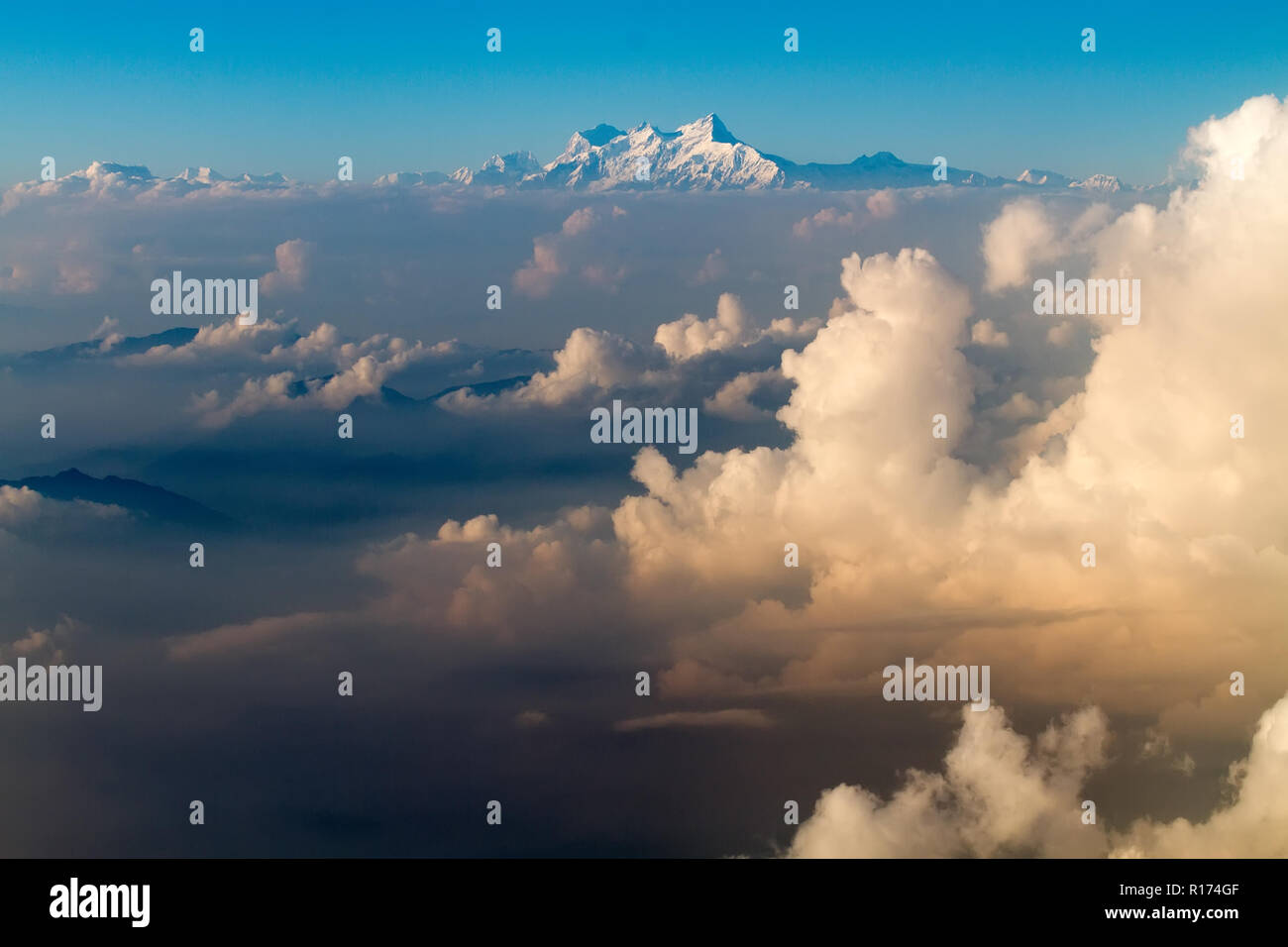 The Everest mount aerial view from plane over cloud sea before landing ...