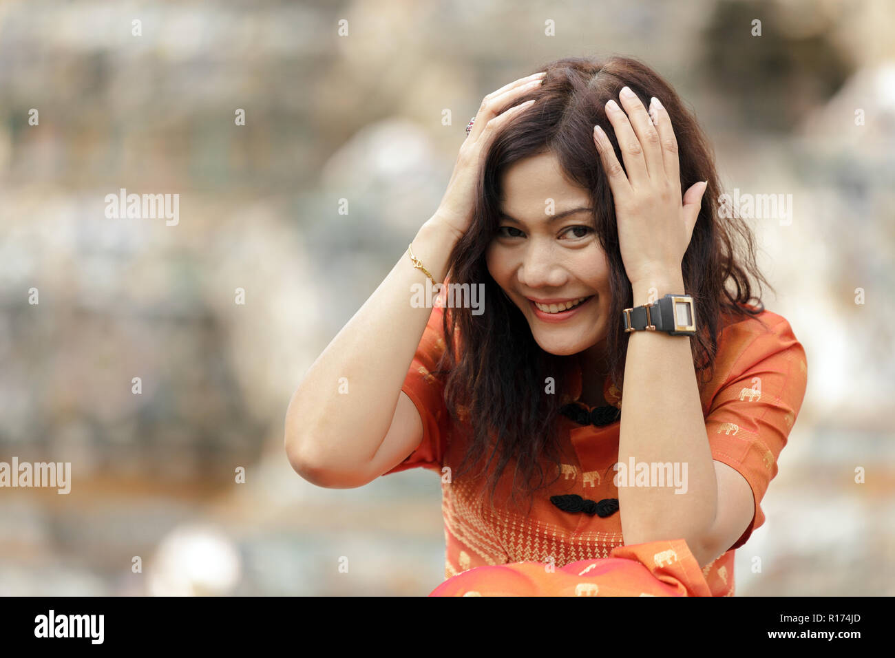 Putting her hands on her head hi-res stock photography and images - Alamy