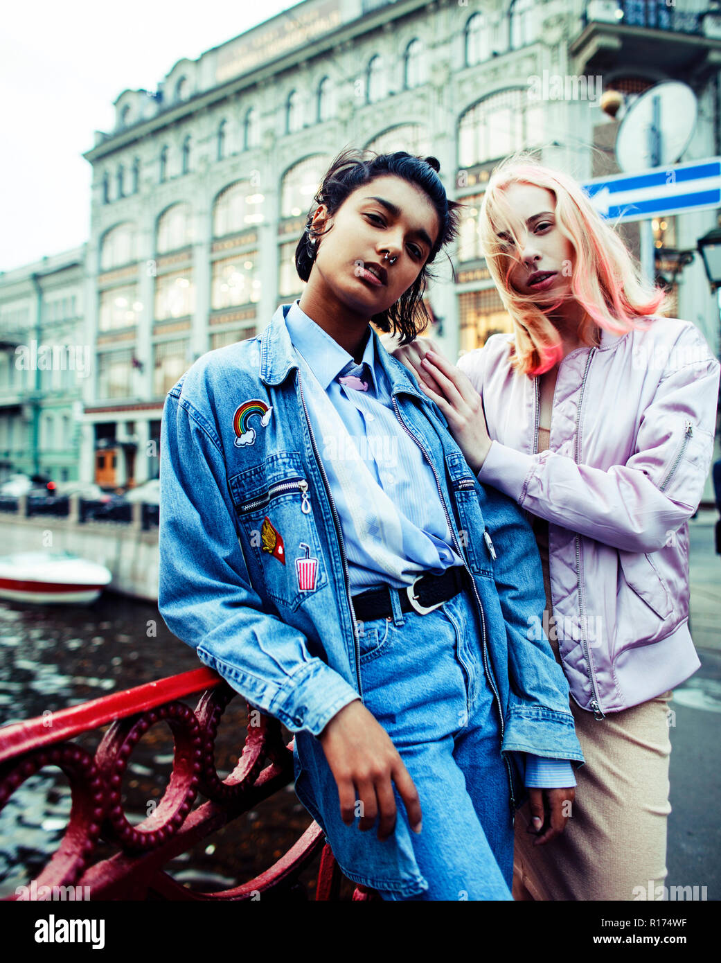 Two teenage girls infront of university building smiling, having Stock ...