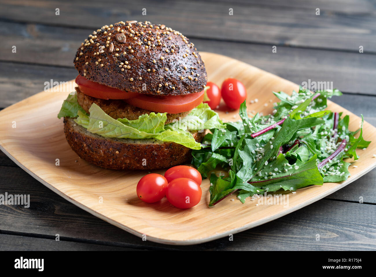veggie burger plated on bombo plate Stock Photo - Alamy