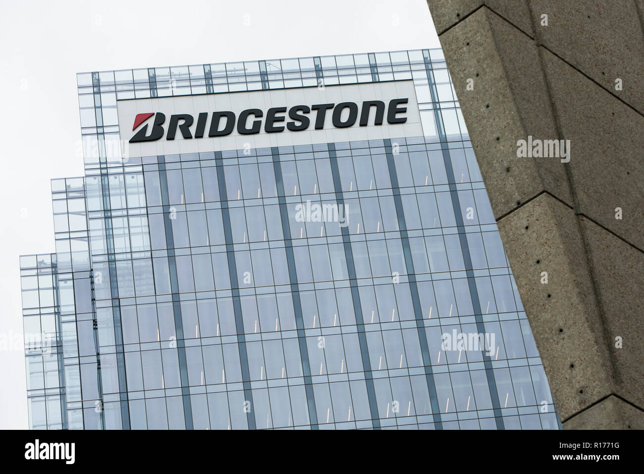 A logo sign outside of the headquarters of Bridgestone Americas in ...