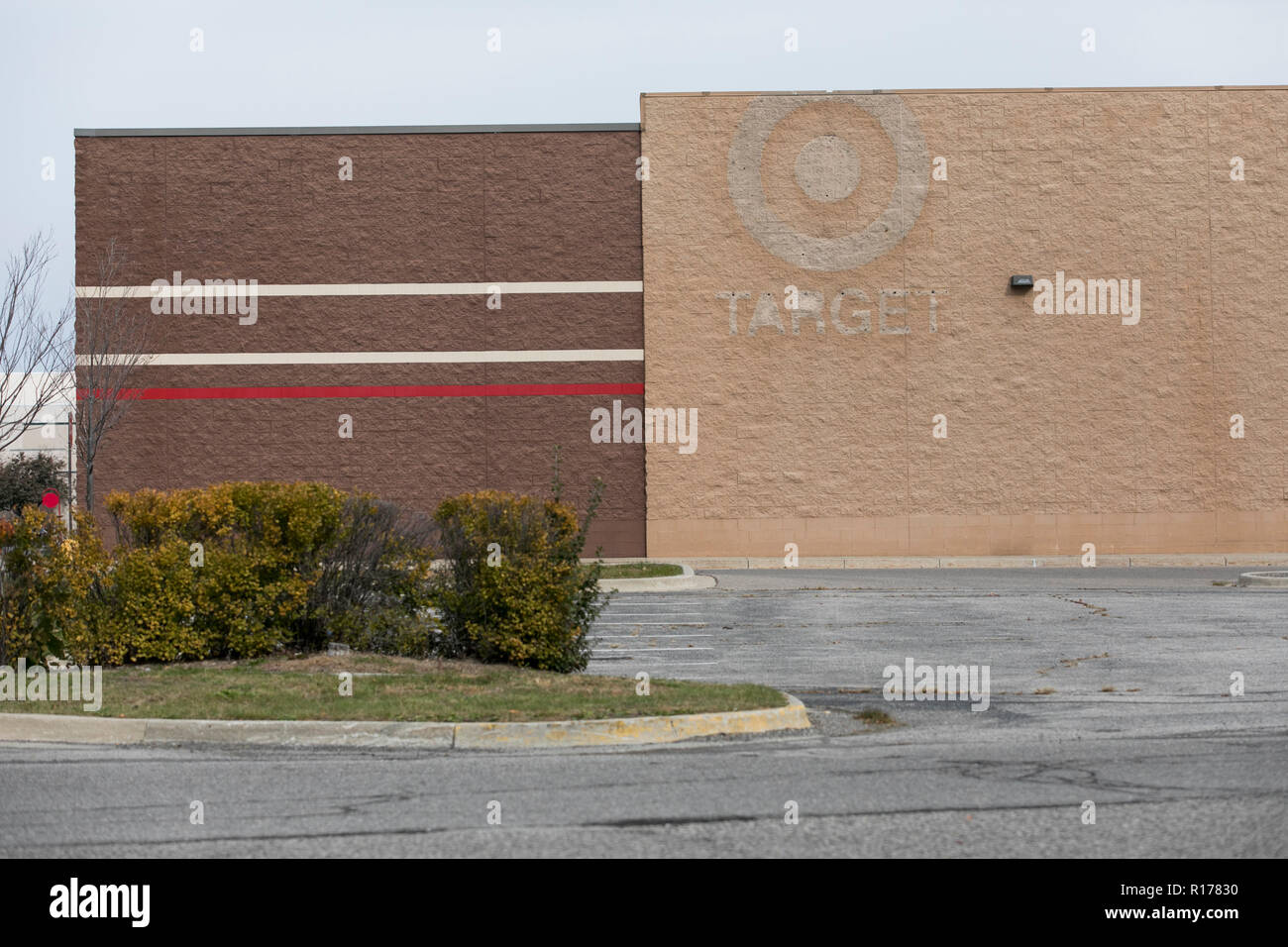 The faded outline of a logo sign outside of a closed Target Corporation ...