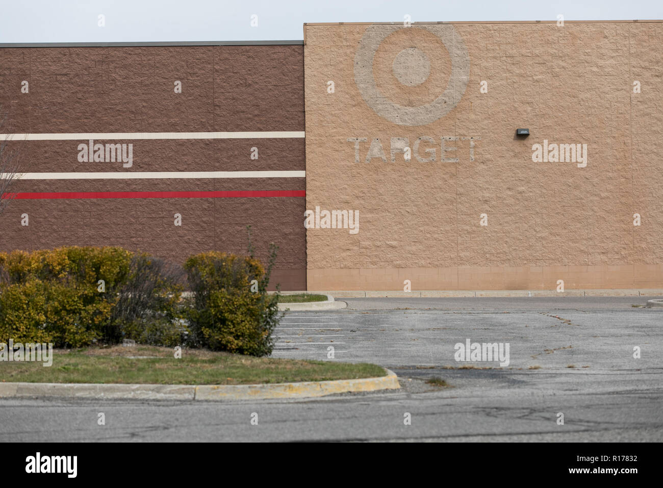 The faded outline of a logo sign outside of a closed Target Corporation ...