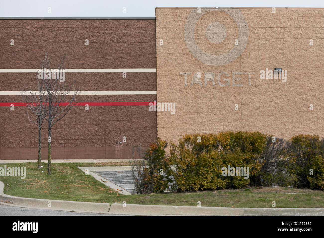 The faded outline of a logo sign outside of a closed Target Corporation ...