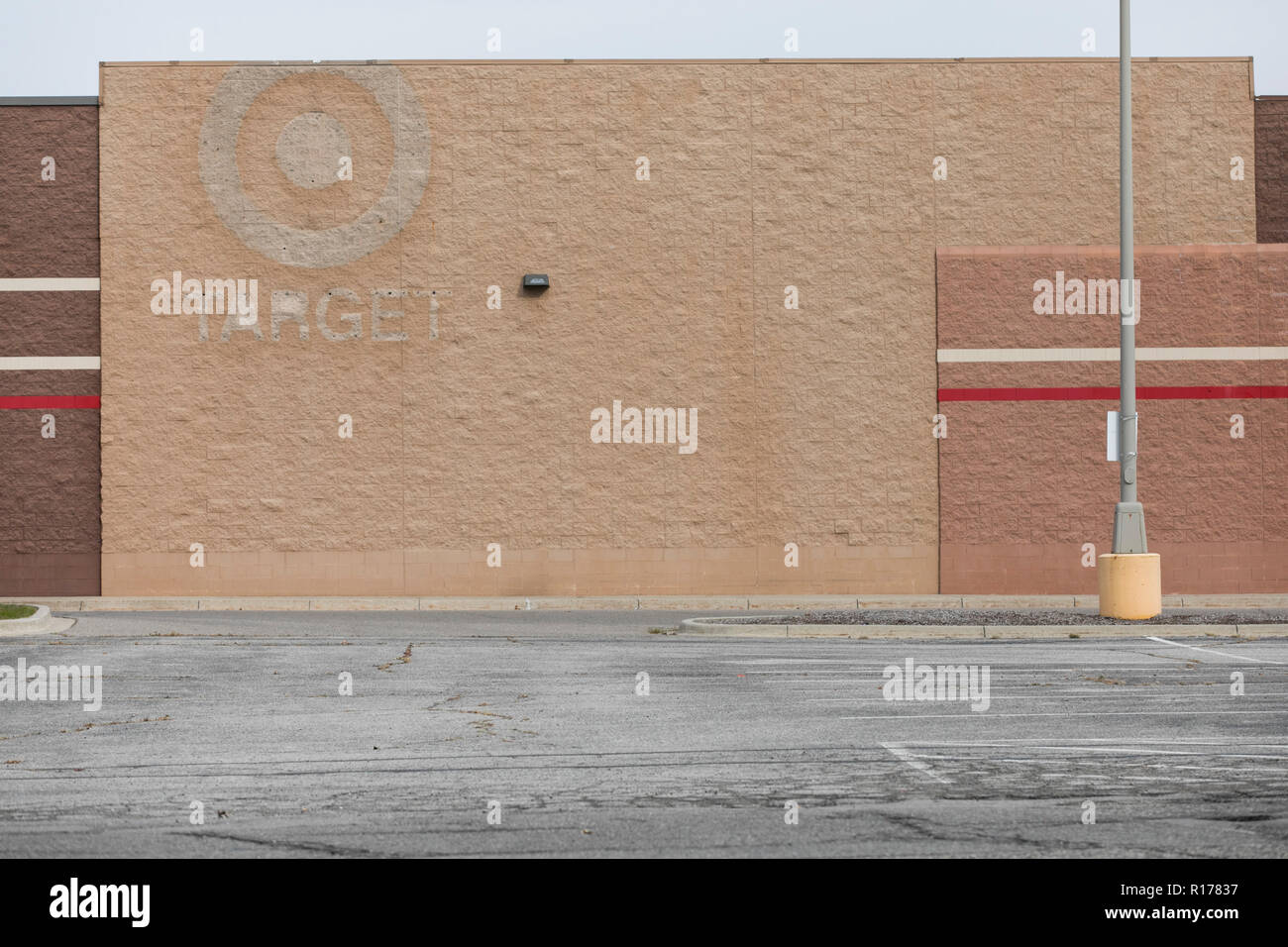 The faded outline of a logo sign outside of a closed Target Corporation ...