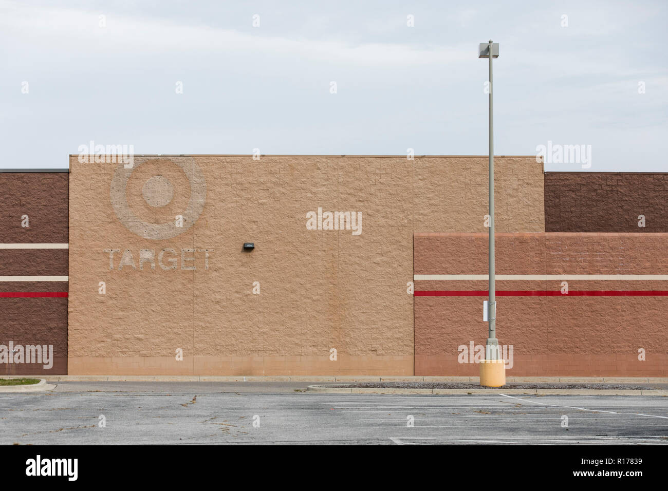 The faded outline of a logo sign outside of a closed Target Corporation ...