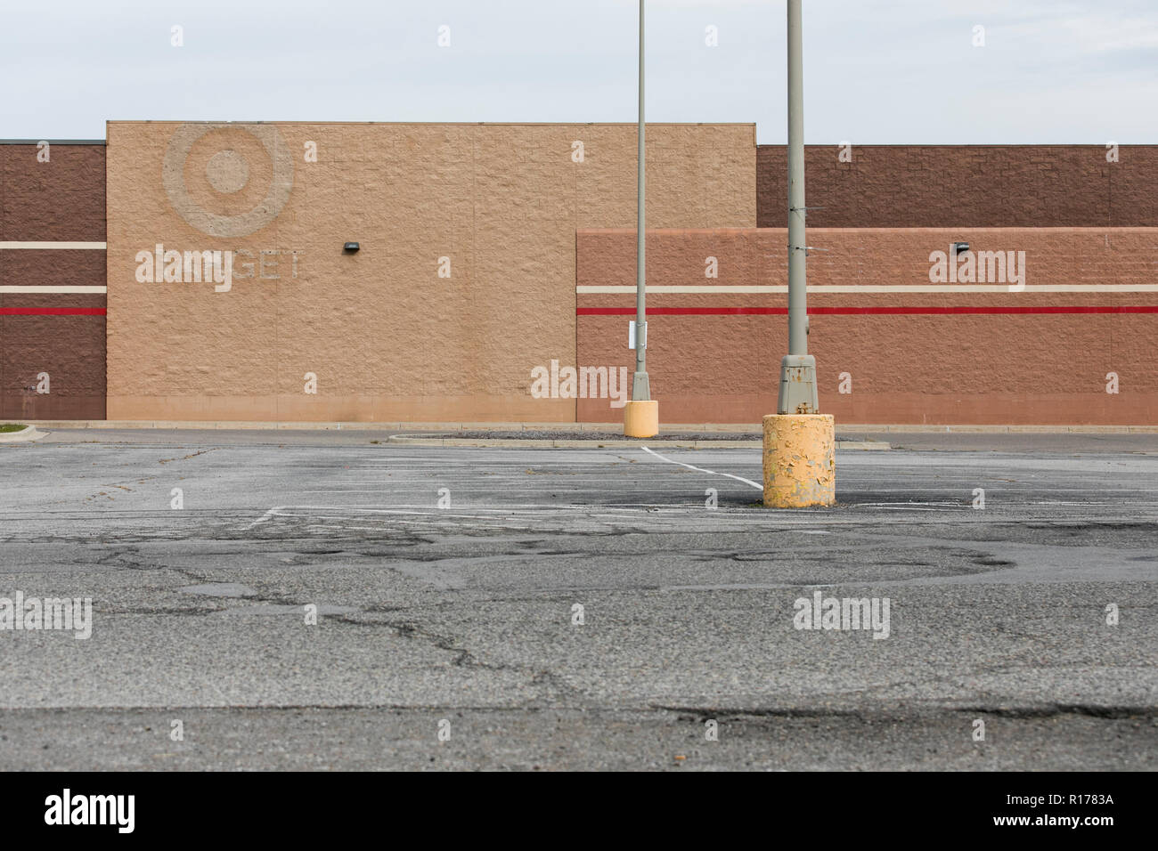 The faded outline of a logo sign outside of a closed Target Corporation ...