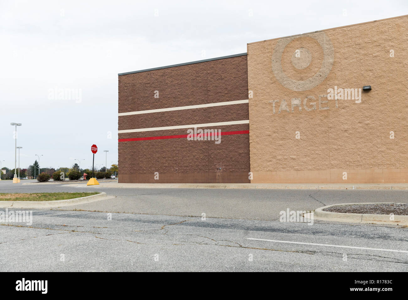 The faded outline of a logo sign outside of a closed Target Corporation ...