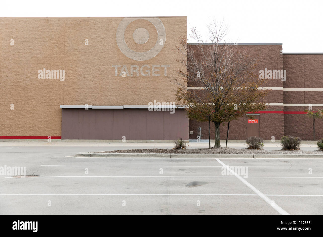 The faded outline of a logo sign outside of a closed Target Corporation ...