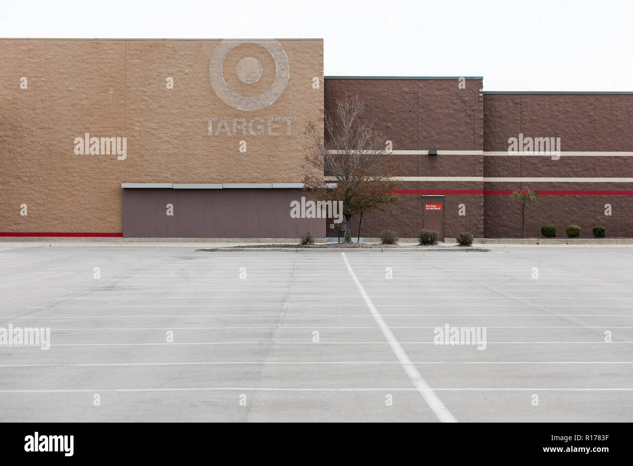 The faded outline of a logo sign outside of a closed Target Corporation ...