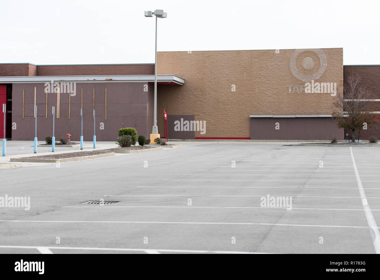 The faded outline of a logo sign outside of a closed Target Corporation ...