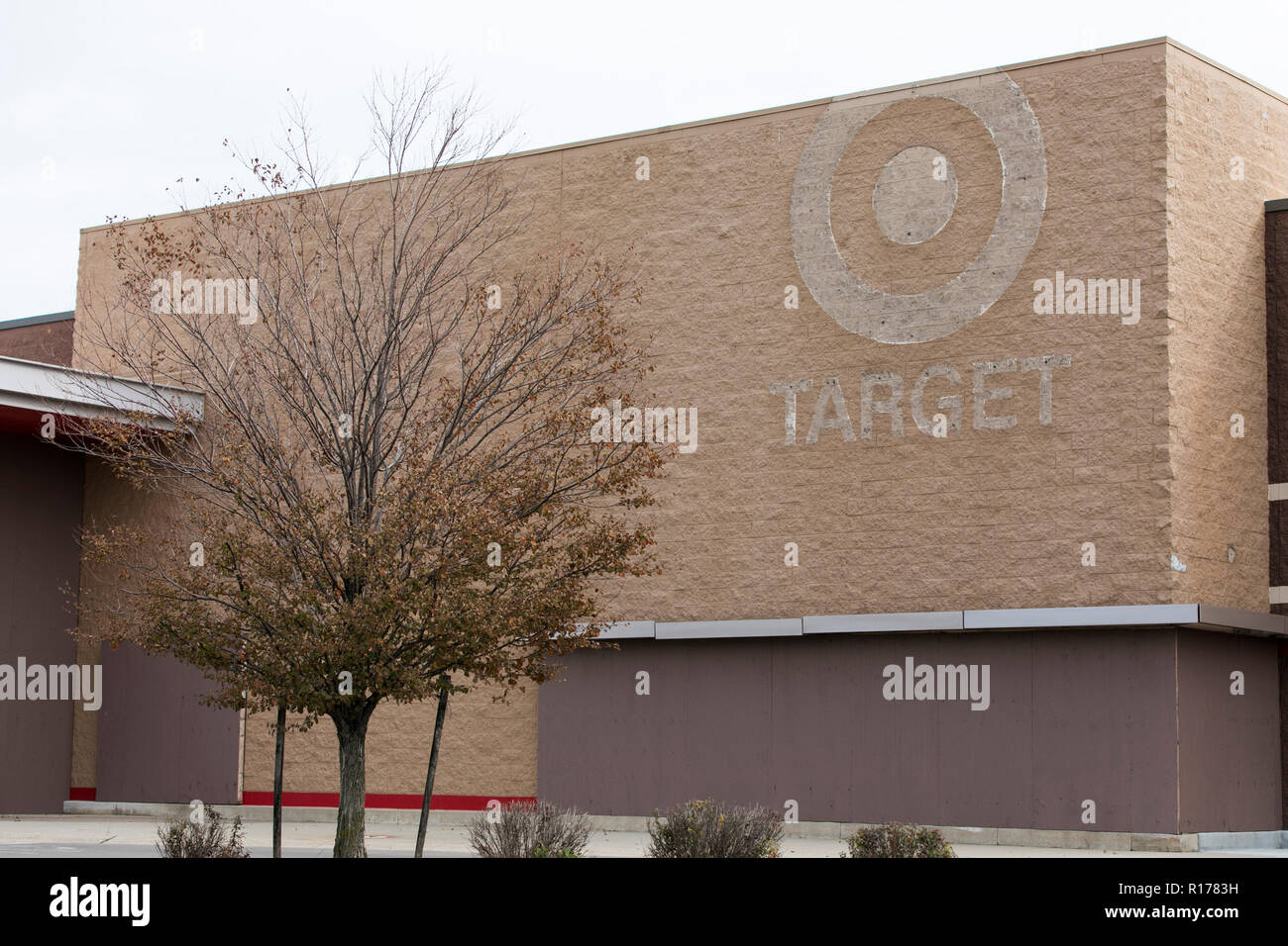 The faded outline of a logo sign outside of a closed Target Corporation ...