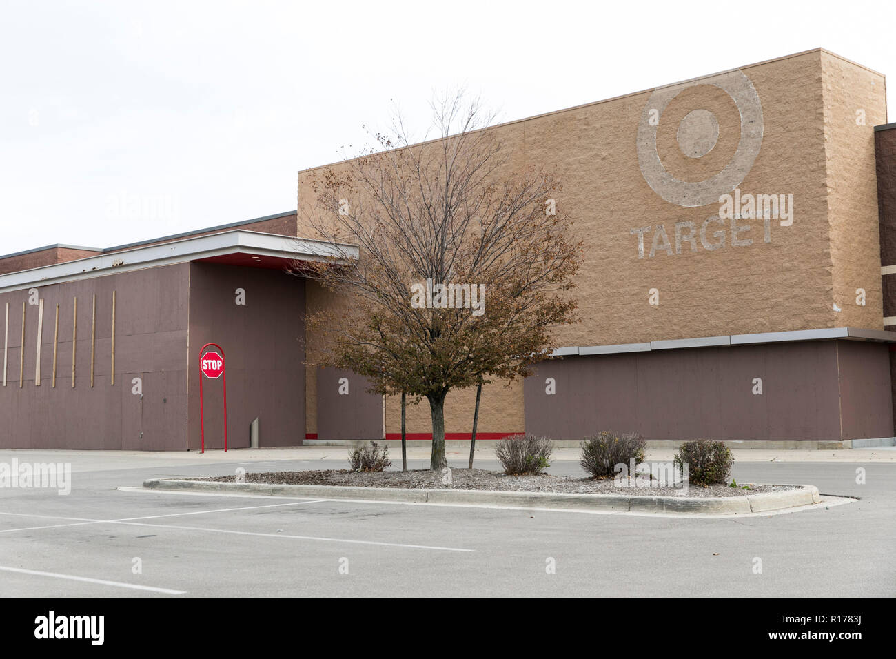 The faded outline of a logo sign outside of a closed Target Corporation ...