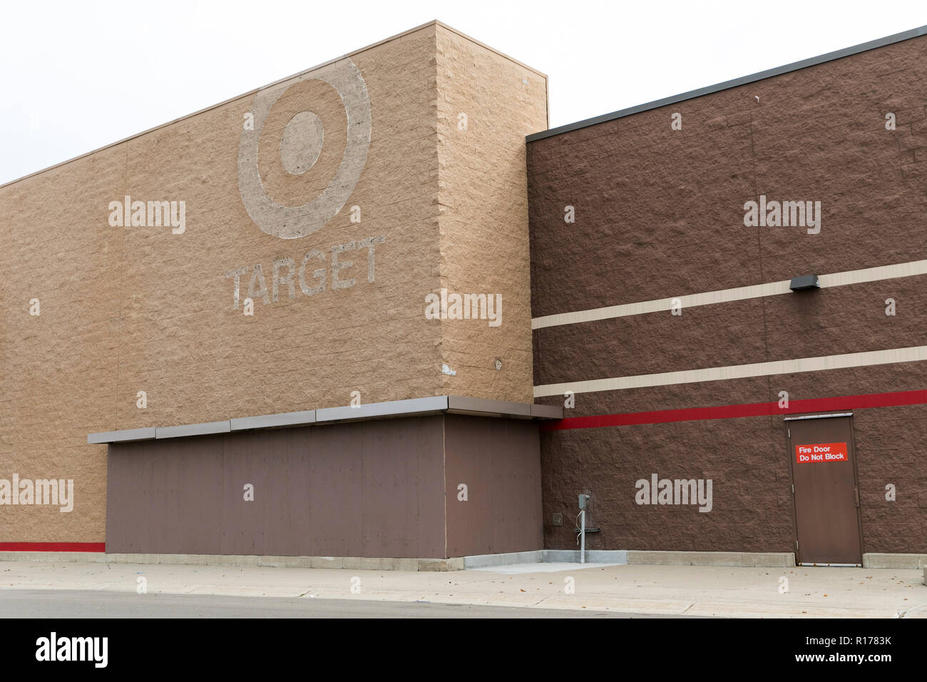 The faded outline of a logo sign outside of a closed Target Corporation ...