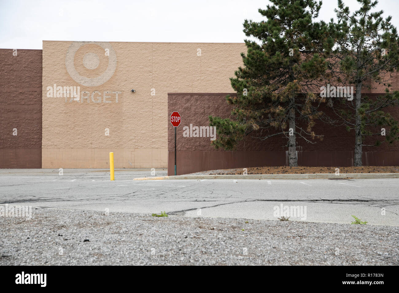 The faded outline of a logo sign outside of a closed Target Corporation ...