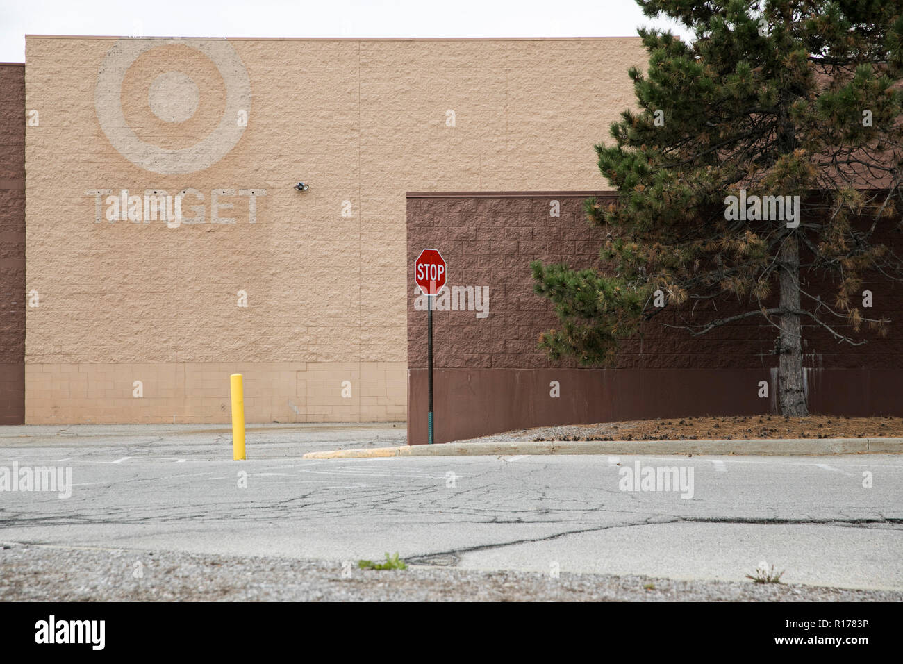 The faded outline of a logo sign outside of a closed Target Corporation ...