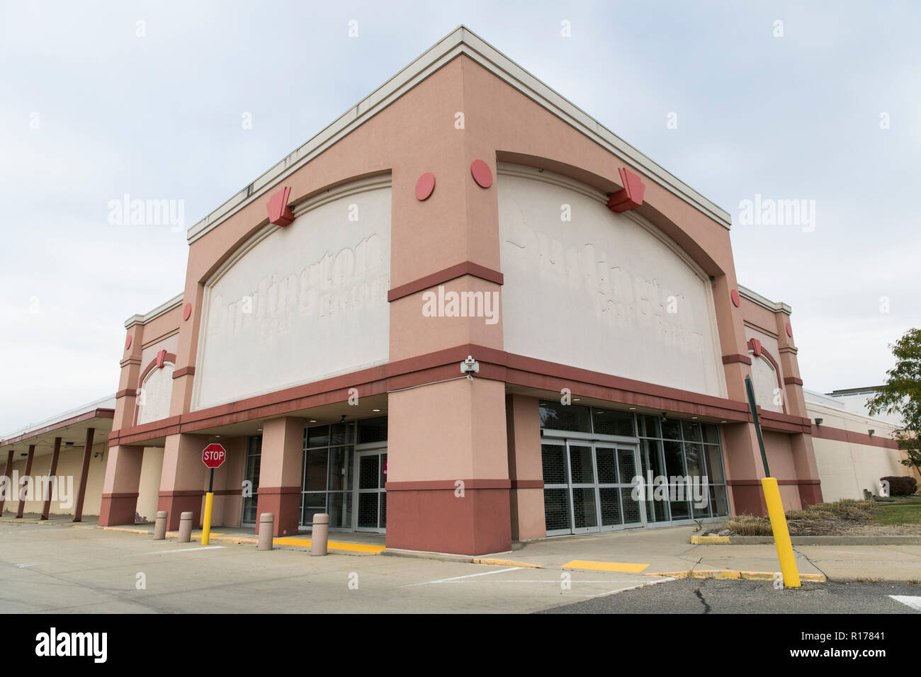 The faded outline of a logo sign outside of a closed Burlington Stores ...