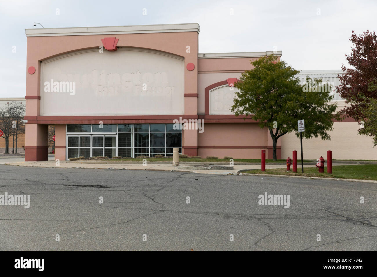 The faded outline of a logo sign outside of a closed Burlington Stores ...