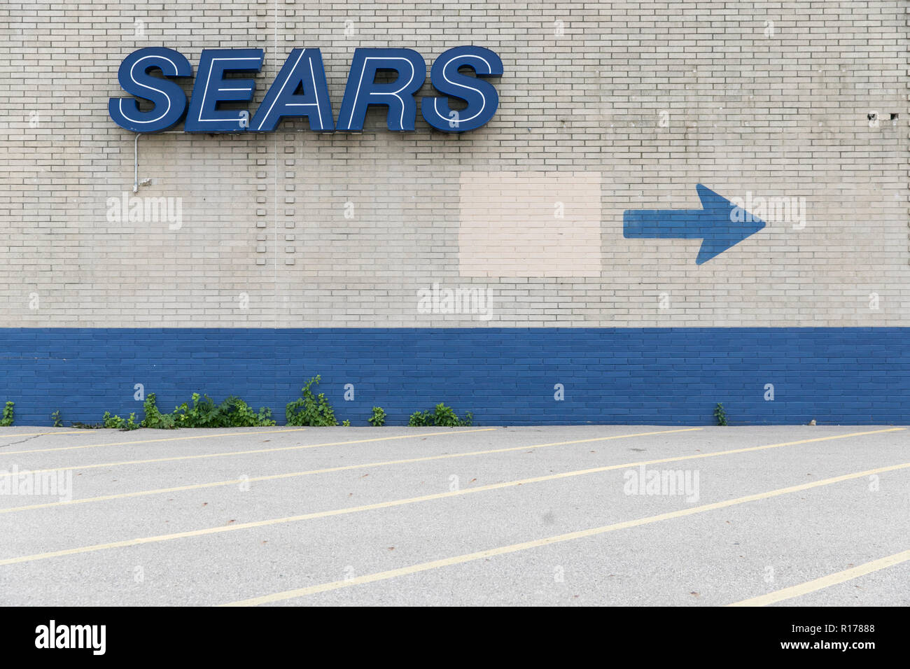 A logo sign outside of Sears retail store in Livonia, Michigan on ...