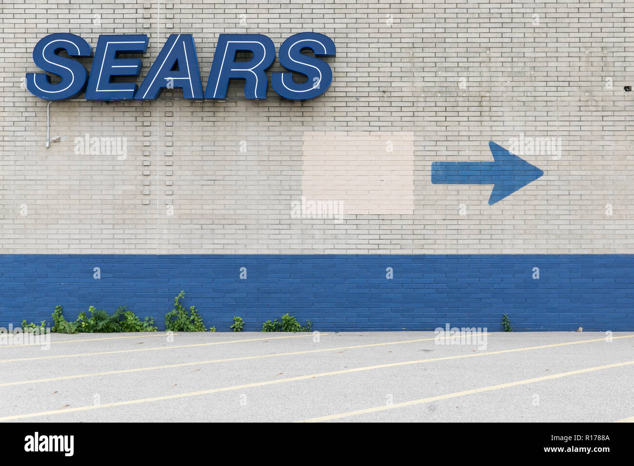 A logo sign outside of Sears retail store in Livonia, Michigan on ...