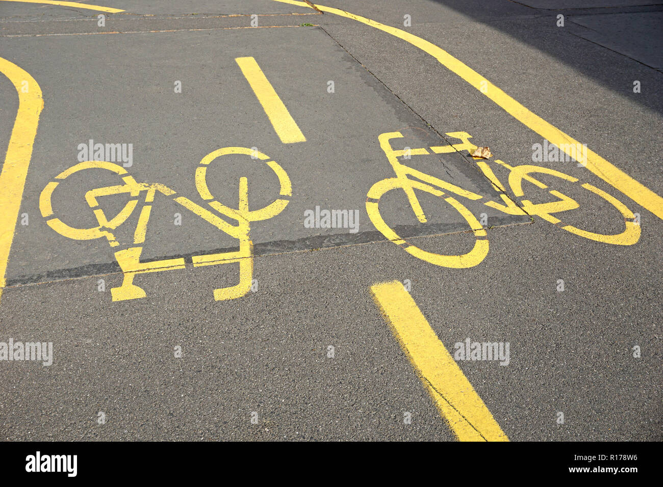 Bicycle road with yellow signs Stock Photo - Alamy