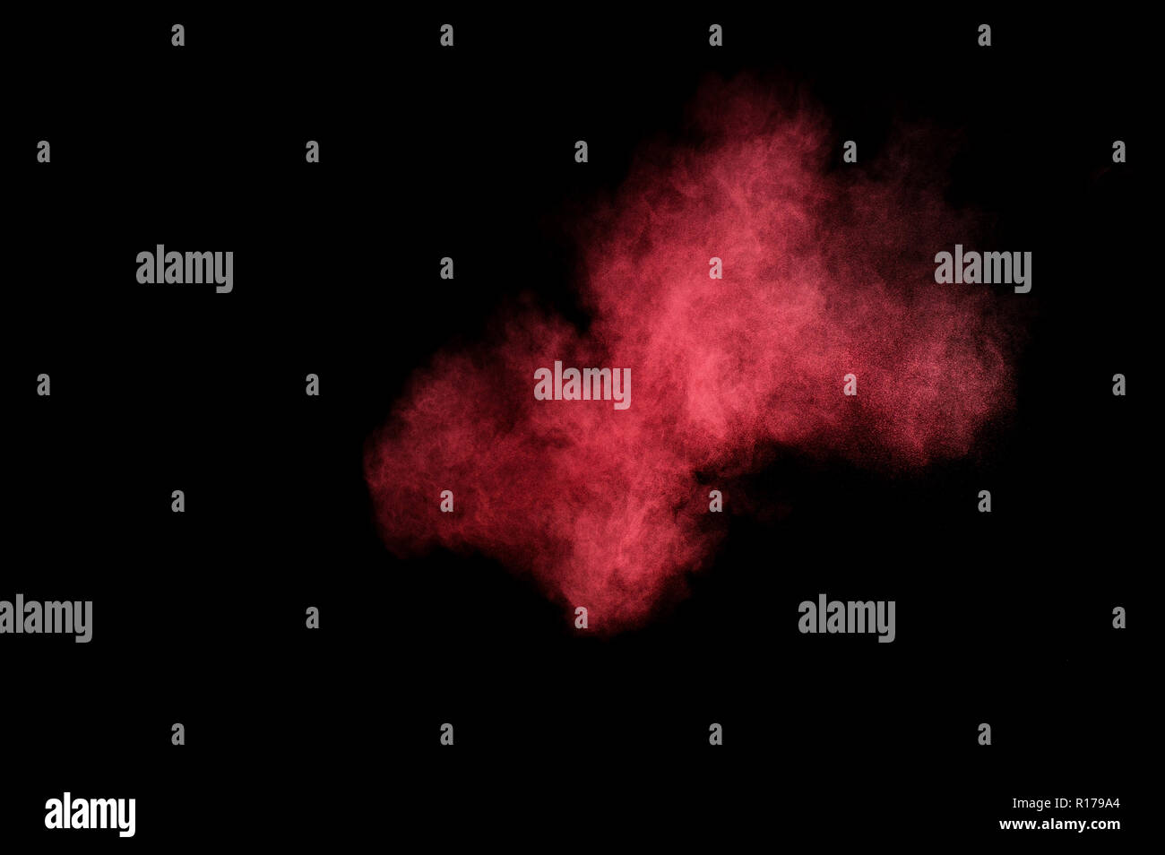 Red and pink powder explosion on black background. Colored powder cloud ...