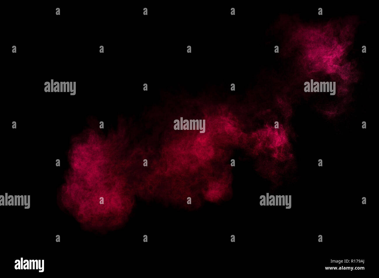 Red and pink powder explosion on black background. Colored powder cloud ...