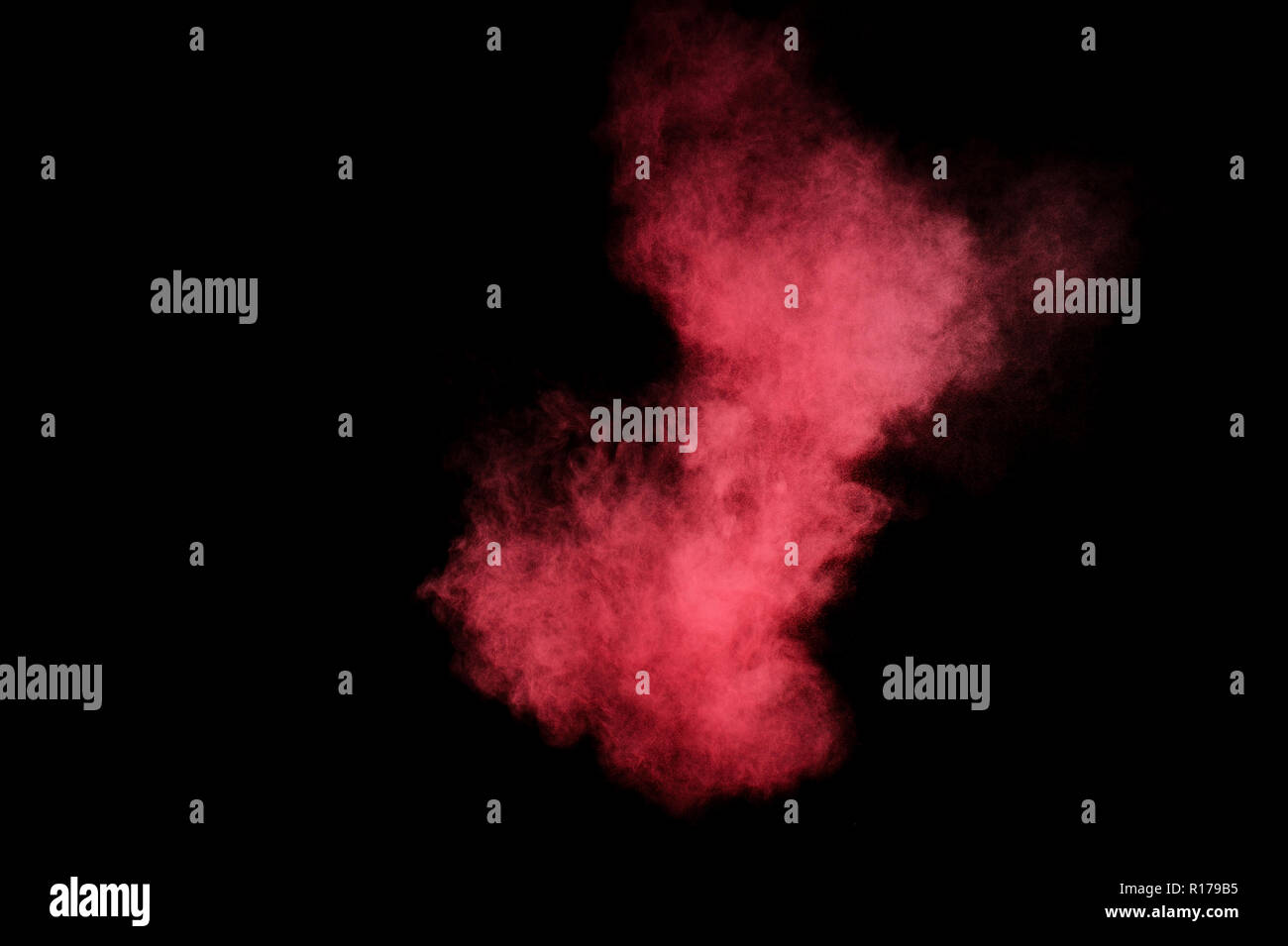 Red and pink powder explosion on black background. Colored powder cloud ...