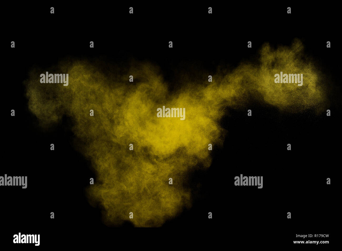 Yellow powder explosion on black background. Colored powder cloud ...