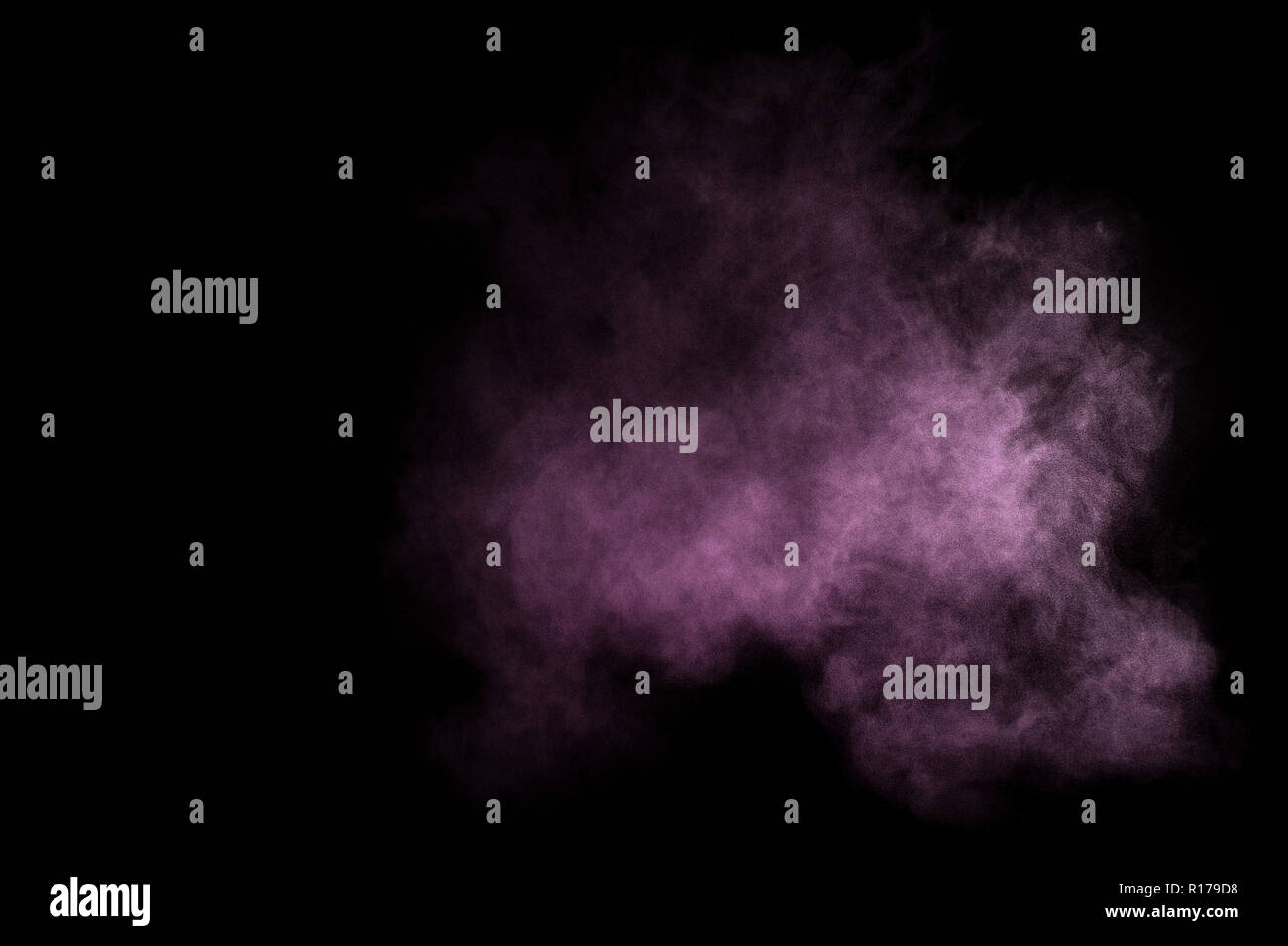 Purple powder explosion on black background. Colored powder cloud ...